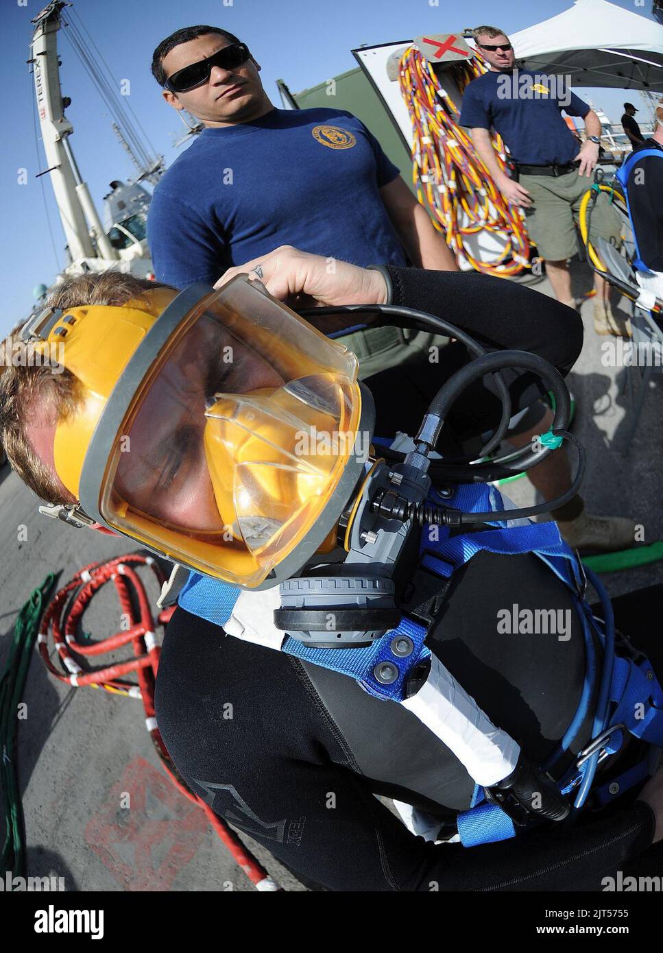 U.S. Navy Diver 1st Class adjusts his Mk 20 diving mask prior to a dive ...