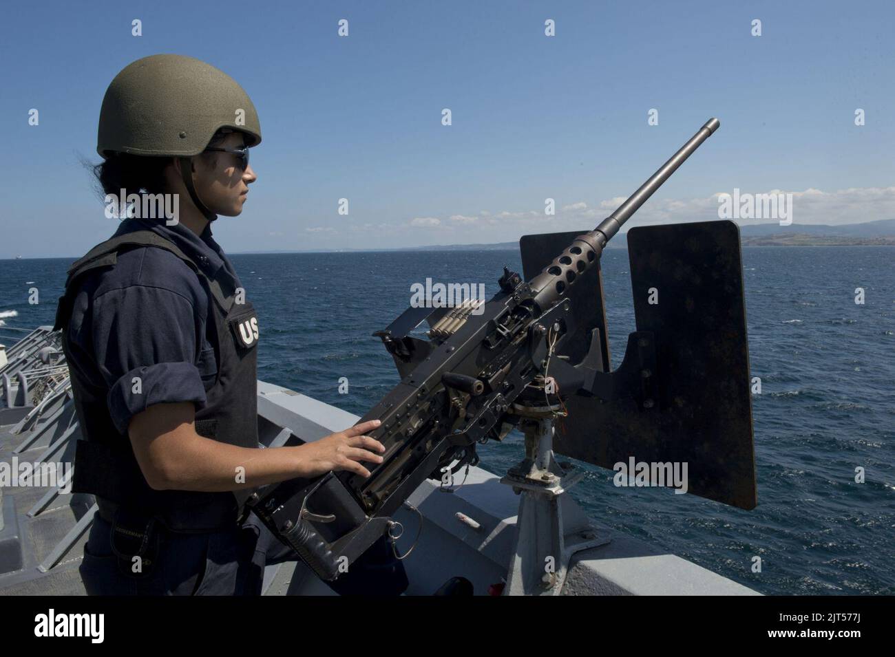 U.S. Navy Electronics Technician 2nd Class stands watch on the bow of ...