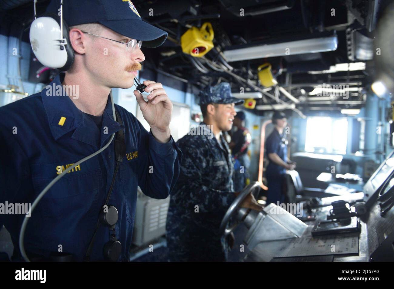 U.S. Navy Ensign assigned to the guided missile destroyer USS Nitze ...