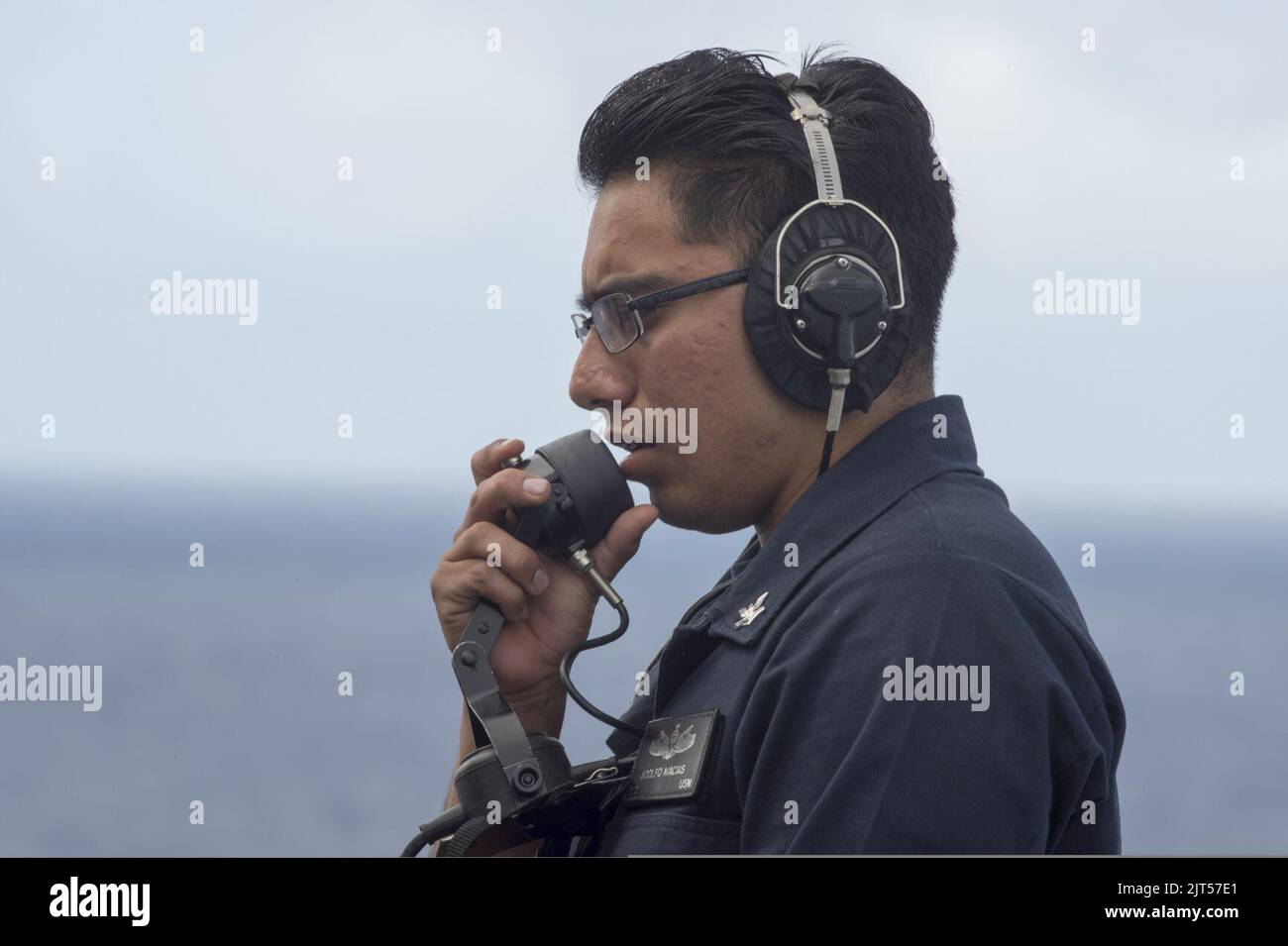 U.S. Navy Fire Controlman 2nd Class performs a daily test for a rolling ...