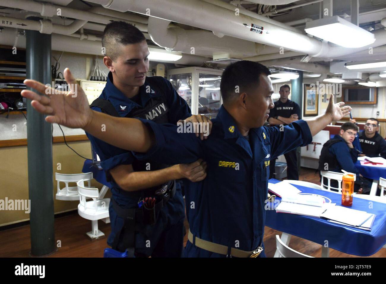 U.S. Navy Fire Controlman 3rd Class left, inspects Chief Culinary ...