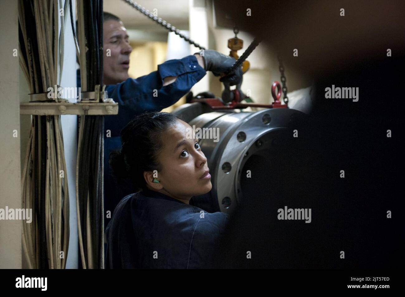 U.S. Navy Gas Turbine System Technician (Electrical) 2nd Class helps ...