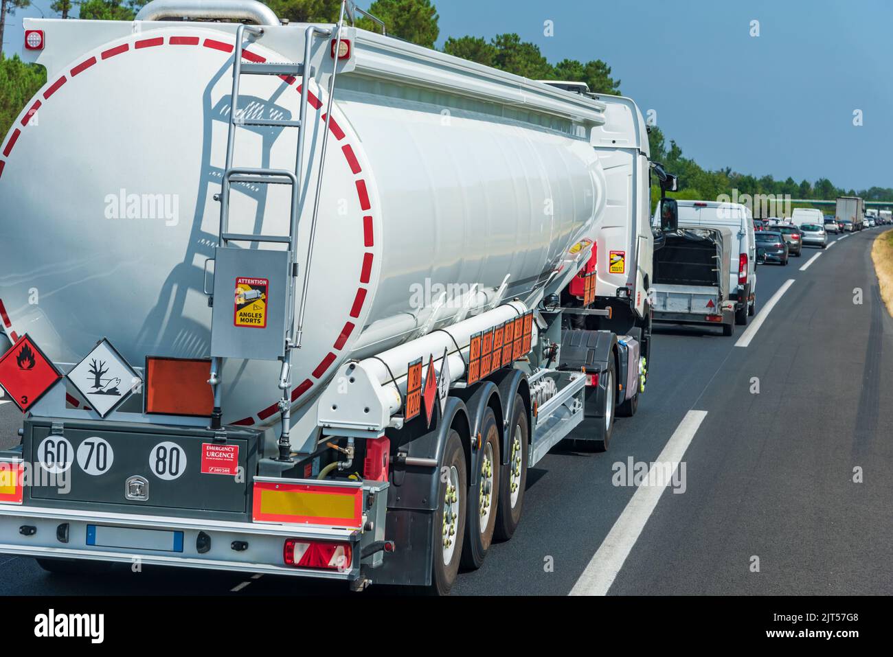 Fuel tanker truck in a retention on the highway with orange panels ...