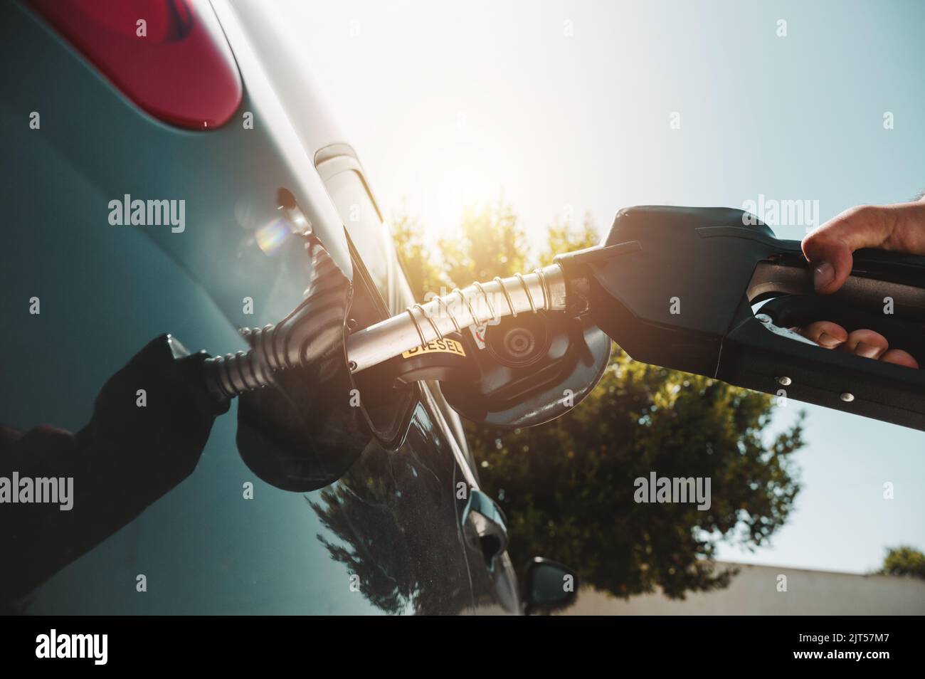 Fuel pump fill a tank of a car in a station Stock Photo - Alamy
