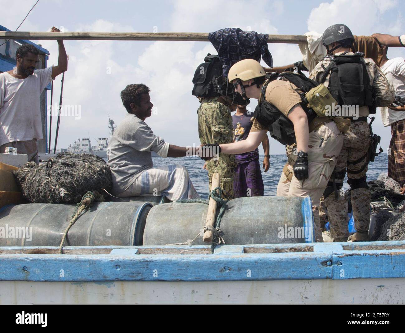 U.S. Navy Intelligence Specialist 3rd Class center, assigned to the ...