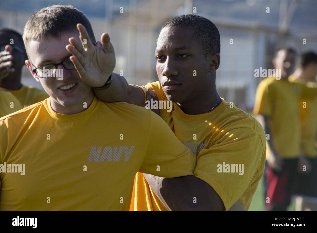 U.S. Navy Information Systems Technician Seamen Krel Jensen, left, and ...