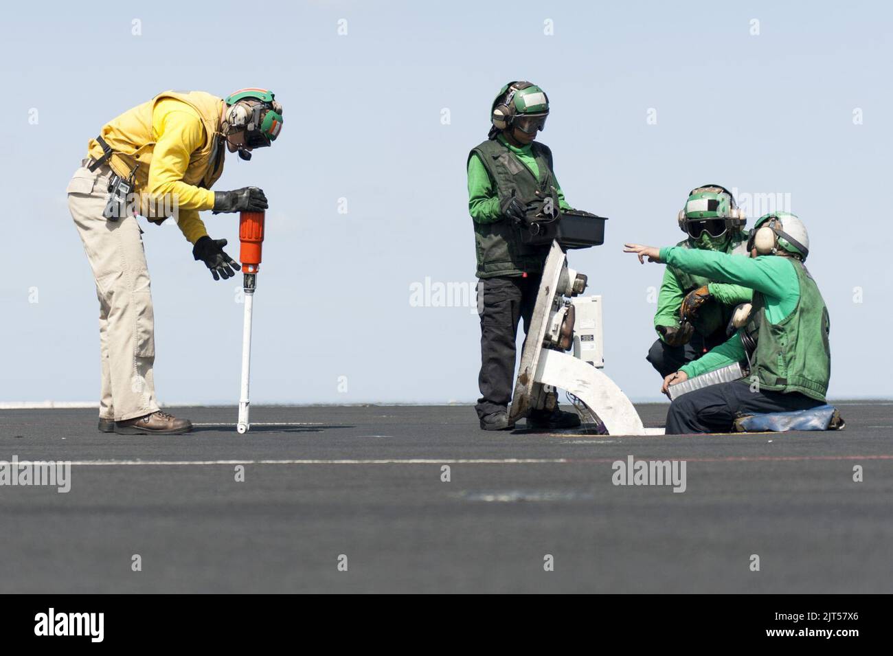 U.S. Navy Lt. left, Aviation Boatswain's Mate (Equipment) Airman center ...