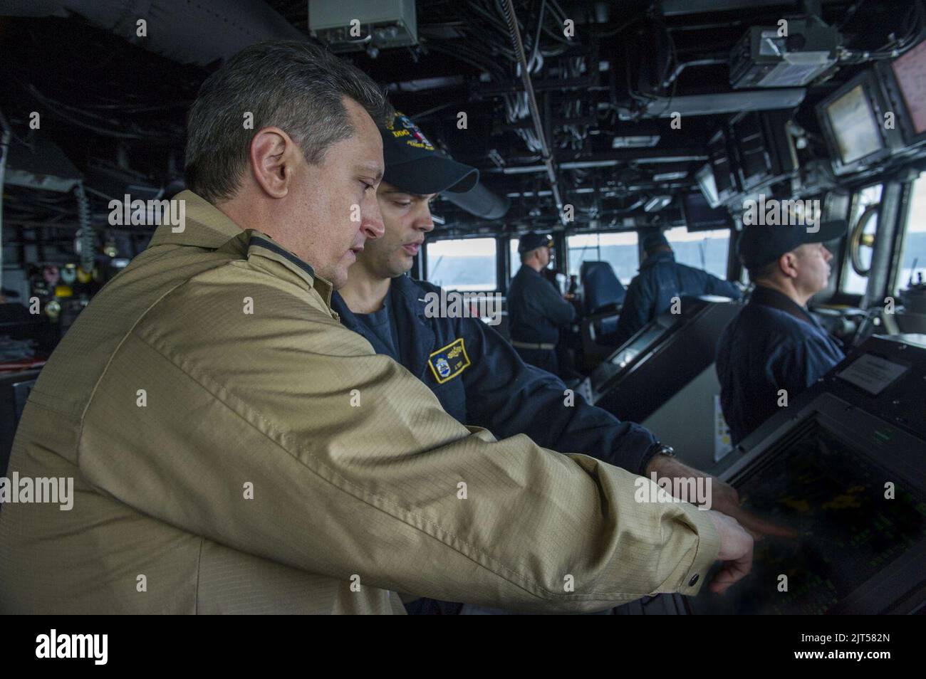 U.S. Navy Lt. j.g. second from left, works alongside Romanian Naval ...