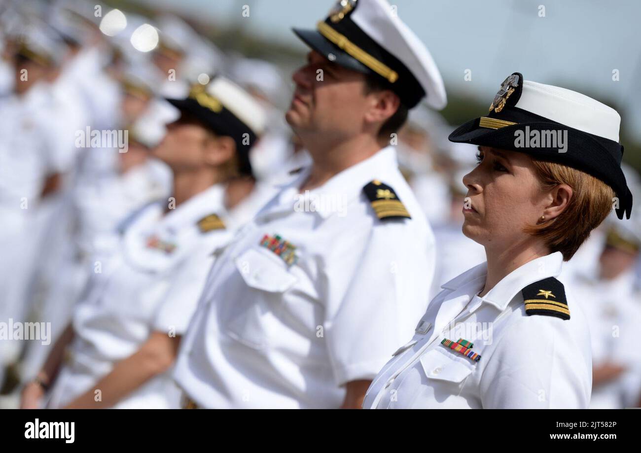 U.S. Navy Lt. j.g. right; Lt. Cmdr. center, the executive officer of ...