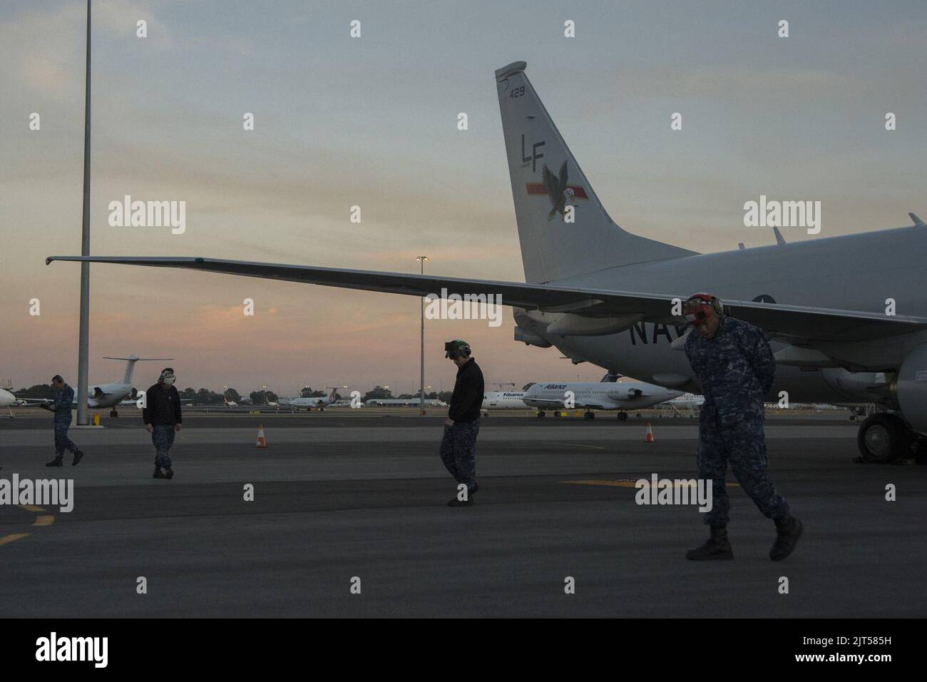 U.S. Navy maintenance crew members assigned to Patrol Squadron (VP) 16 ...