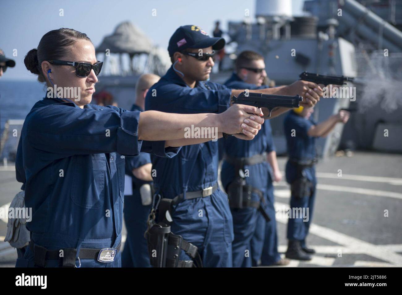 U.S. Navy Master-at-Arms 1st Class left, and Gunner's Mate 2nd Class ...