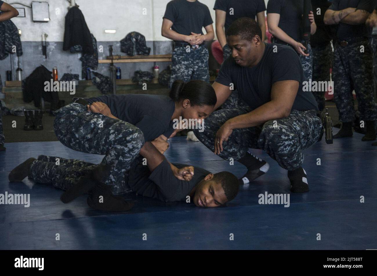 U.S. Navy Master-At-Arms 1st Class right, shows Aviation Maintenance ...