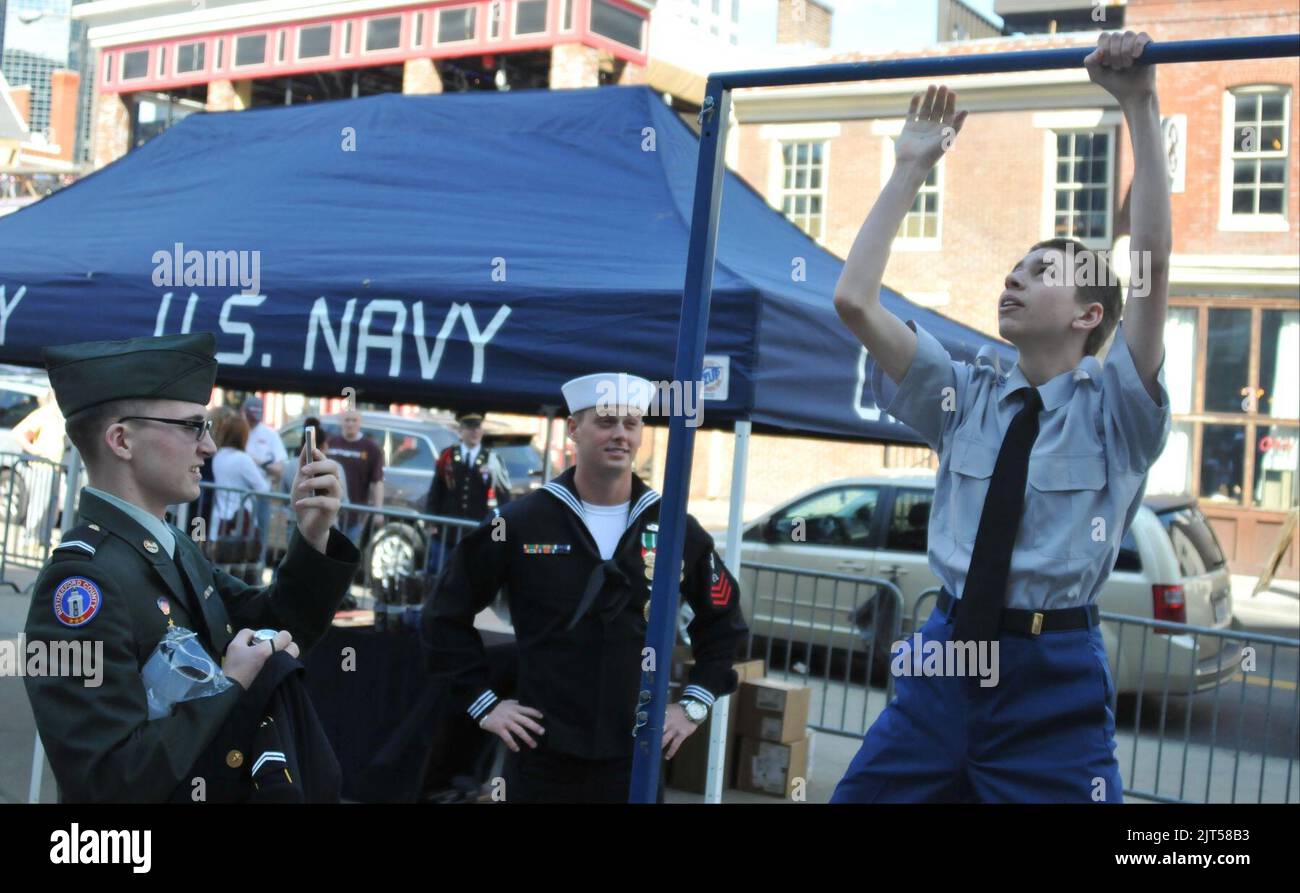 U.S. Navy Operations Specialist 1st Class center, a recruiter stationed ...