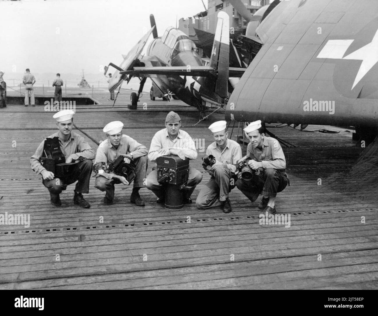 U.S. Navy photographers aboard USS Makin Island (CVE-93), in 1945 Stock ...