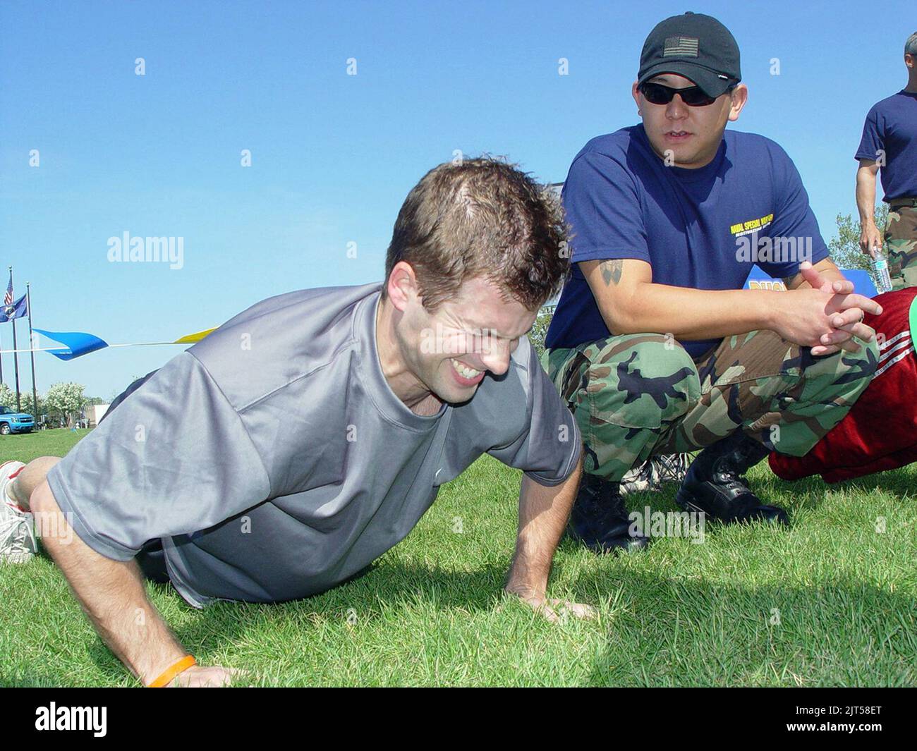 U.S. Navy Petty Officer 1st Class counts push-ups at the Navy SEAL ...
