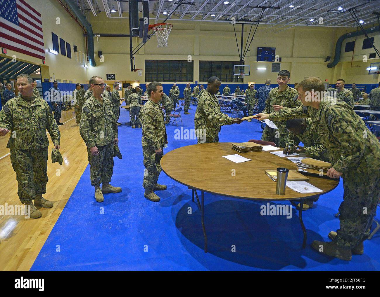U.S. Navy petty officers first class receive their chief exam folders ...