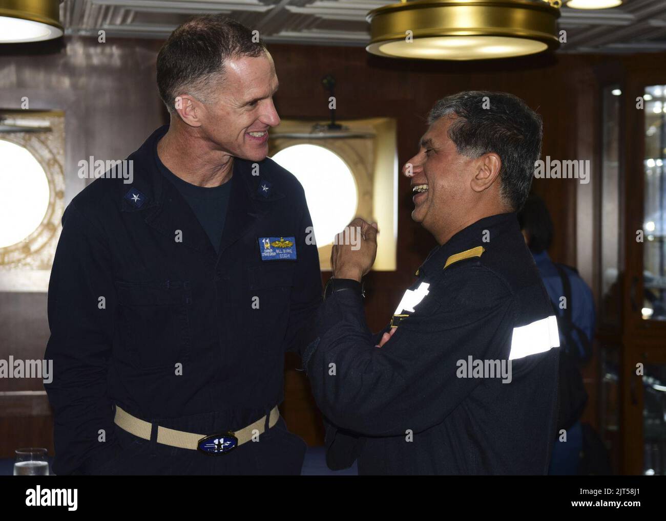 U.S. Navy Rear Adm. Bill Byrne and Indian Navy Rear Admiral Biswajit ...
