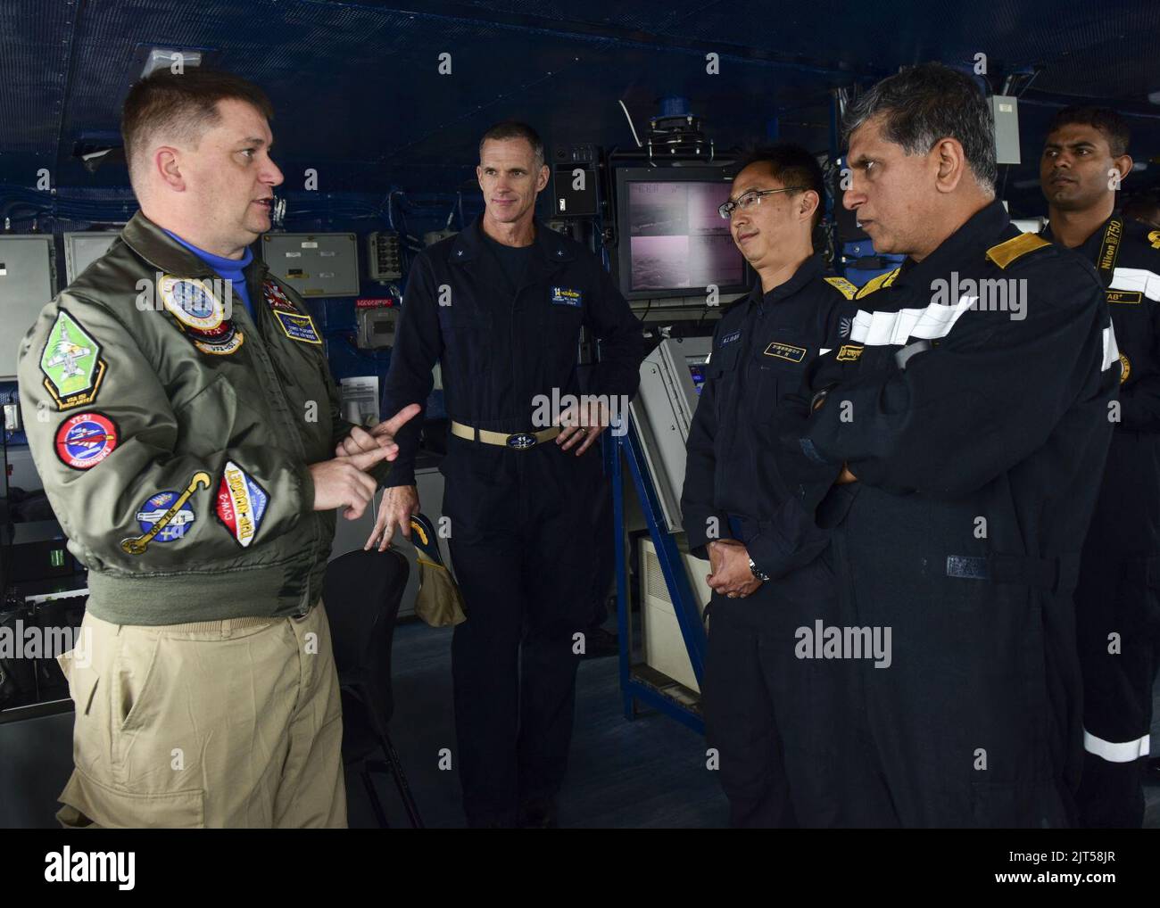 U.S. Navy Rear Adm. Bill Byrne, JMSDF Rear Admiral Yoshihiro Goka, and Indian Navy Rear Admiral ...