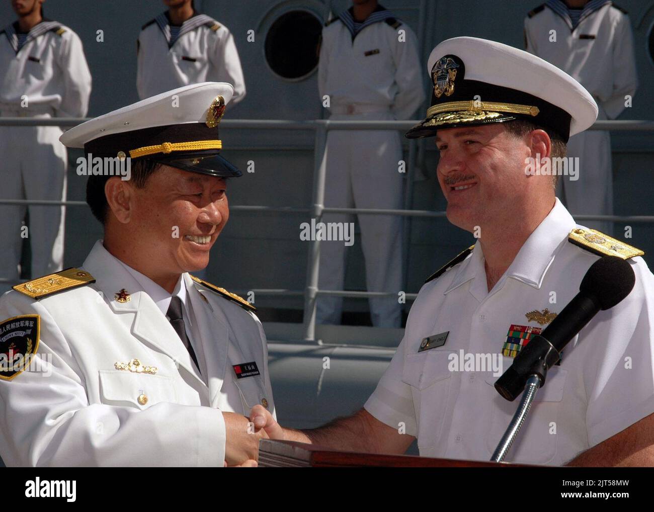 U.S. Navy Rear Adm. Gary A Engle (right) shakes hands with Chinese ...
