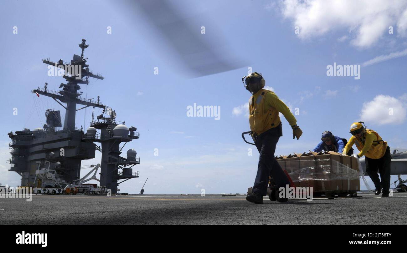 U.S. Navy Sailors assigned to the Nimitz-class aircraft carrier USS ...