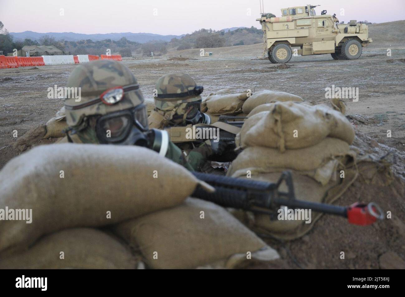 U.S. Navy Seabees with Naval Mobile Construction Battalion 3 keep watch ...
