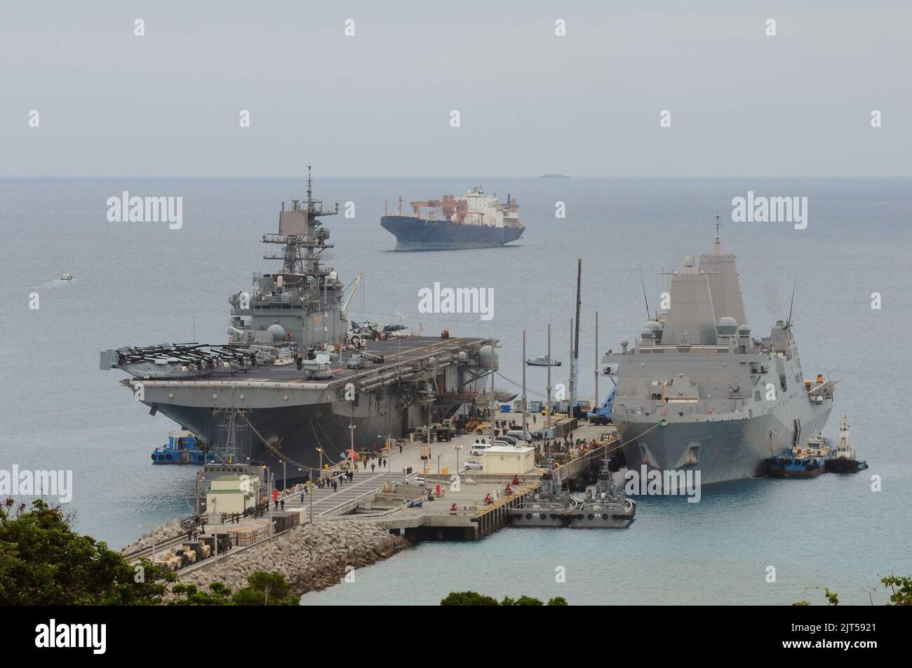 U.S. Navy ships are docked at White Beach Naval Facility, Okinawa ...