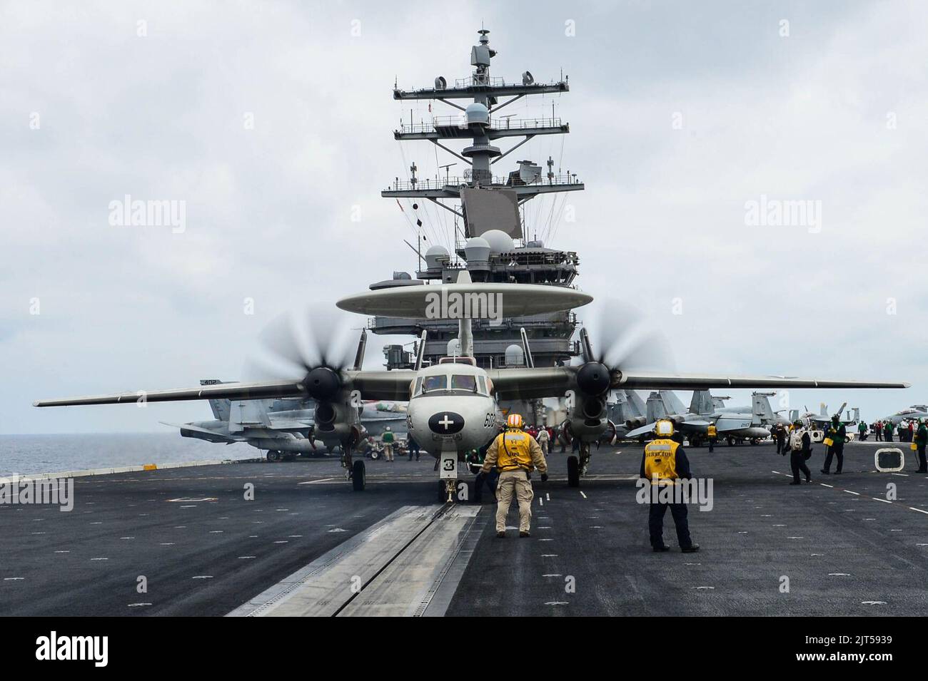 U.S. Navy Senior Chief Aviation Boatswain's Mate (Handling) left, and ...