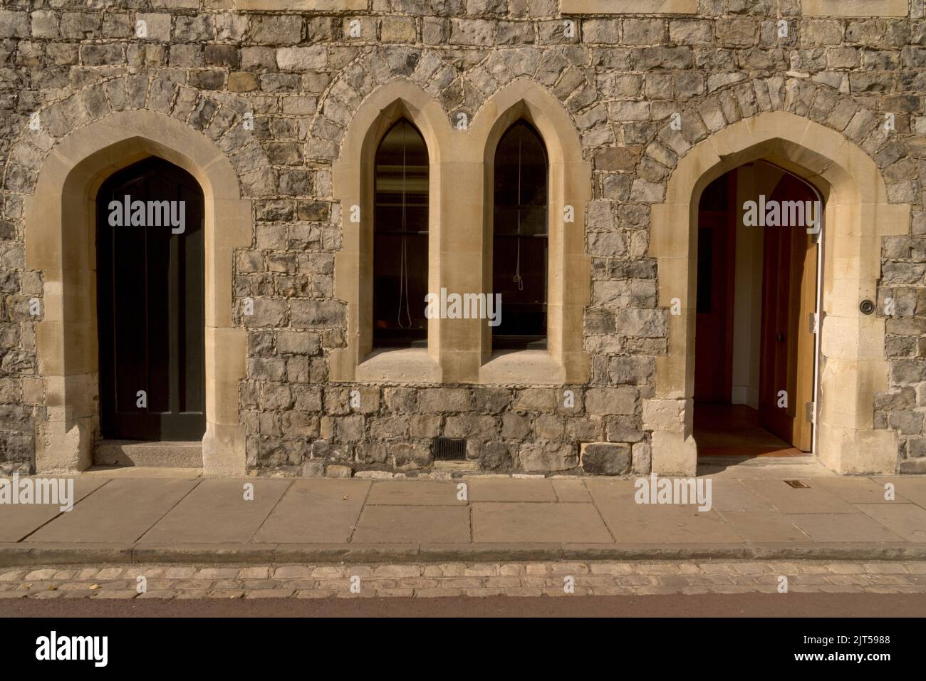 Detail of medieval castle wall made of massive stone bricks and two ...