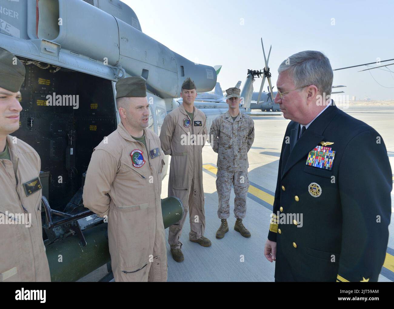 U.S. Navy Vice Adm. John W. Miller, right, the commander of U.S. Naval ...