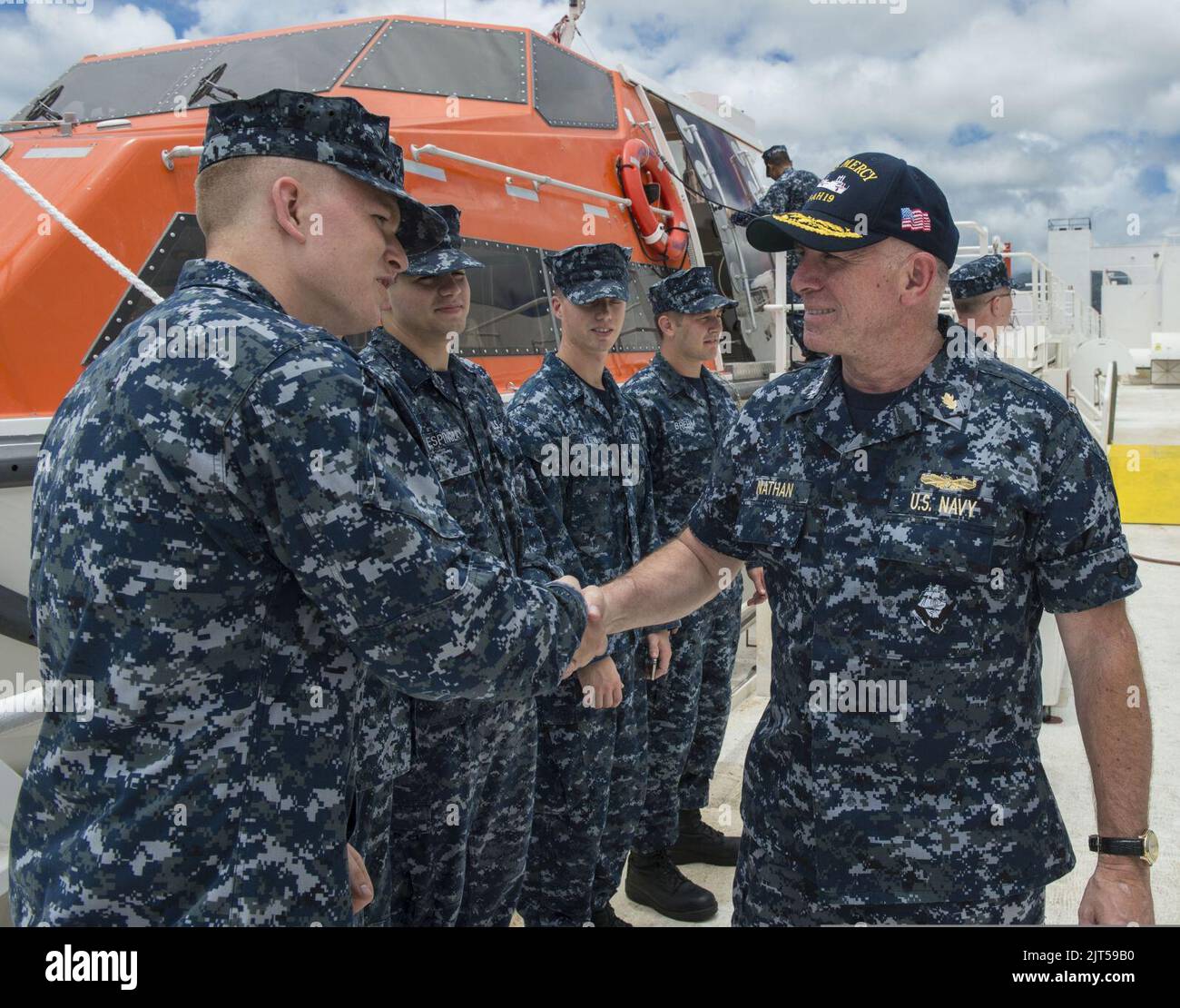 U.S. Navy Vice Adm. Matthew L. Nathan, right, the surgeon general of ...