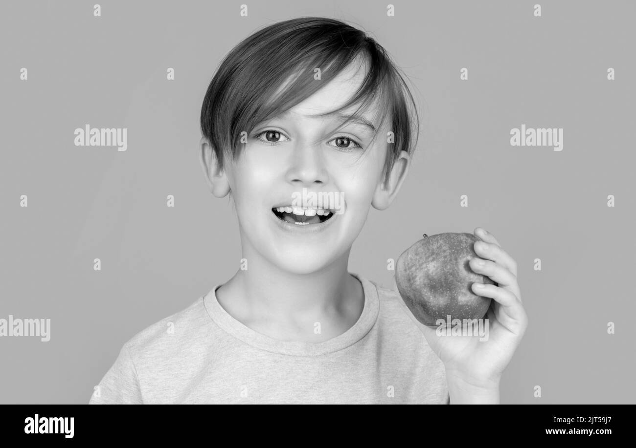 Little boy eating apple Black and White Stock Photos & Images - Alamy