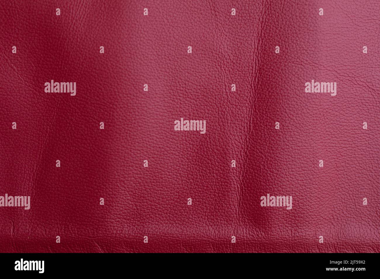 A maroon color leather surface Stock Photo - Alamy