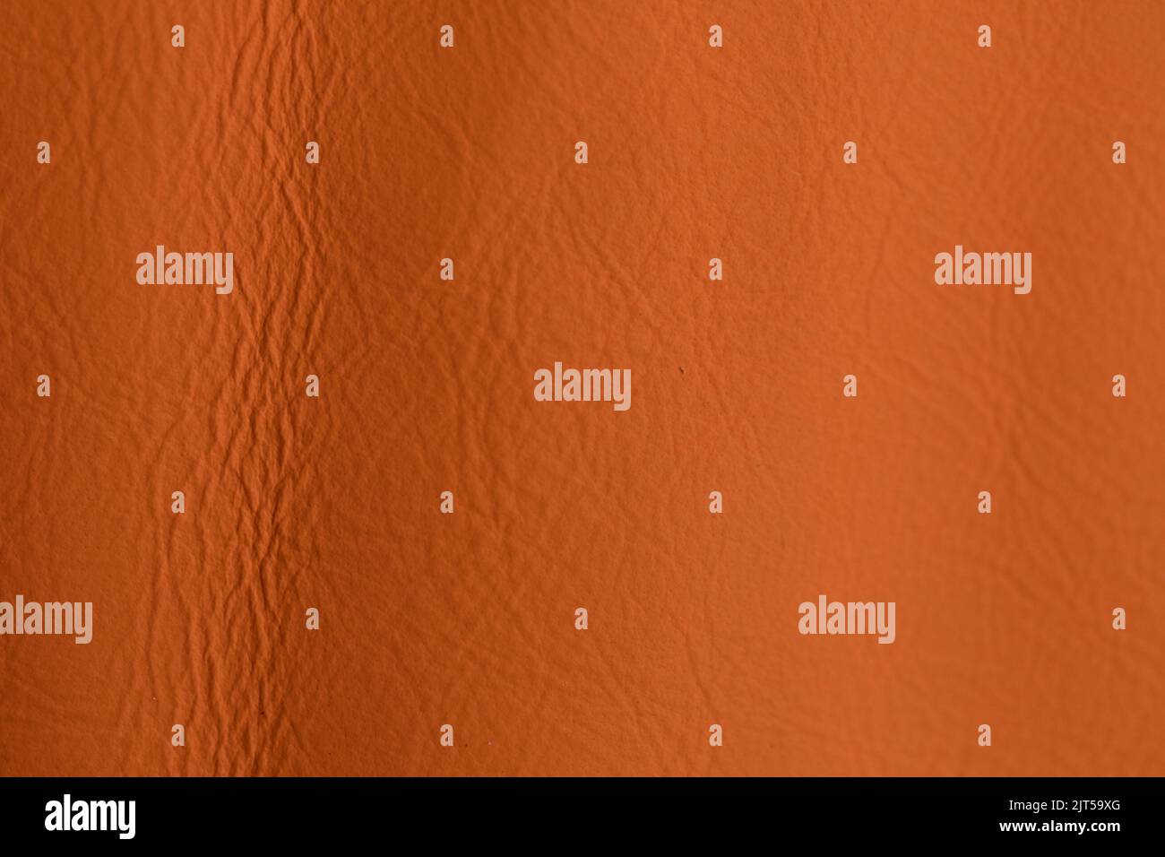 An orange color leather surface Stock Photo - Alamy