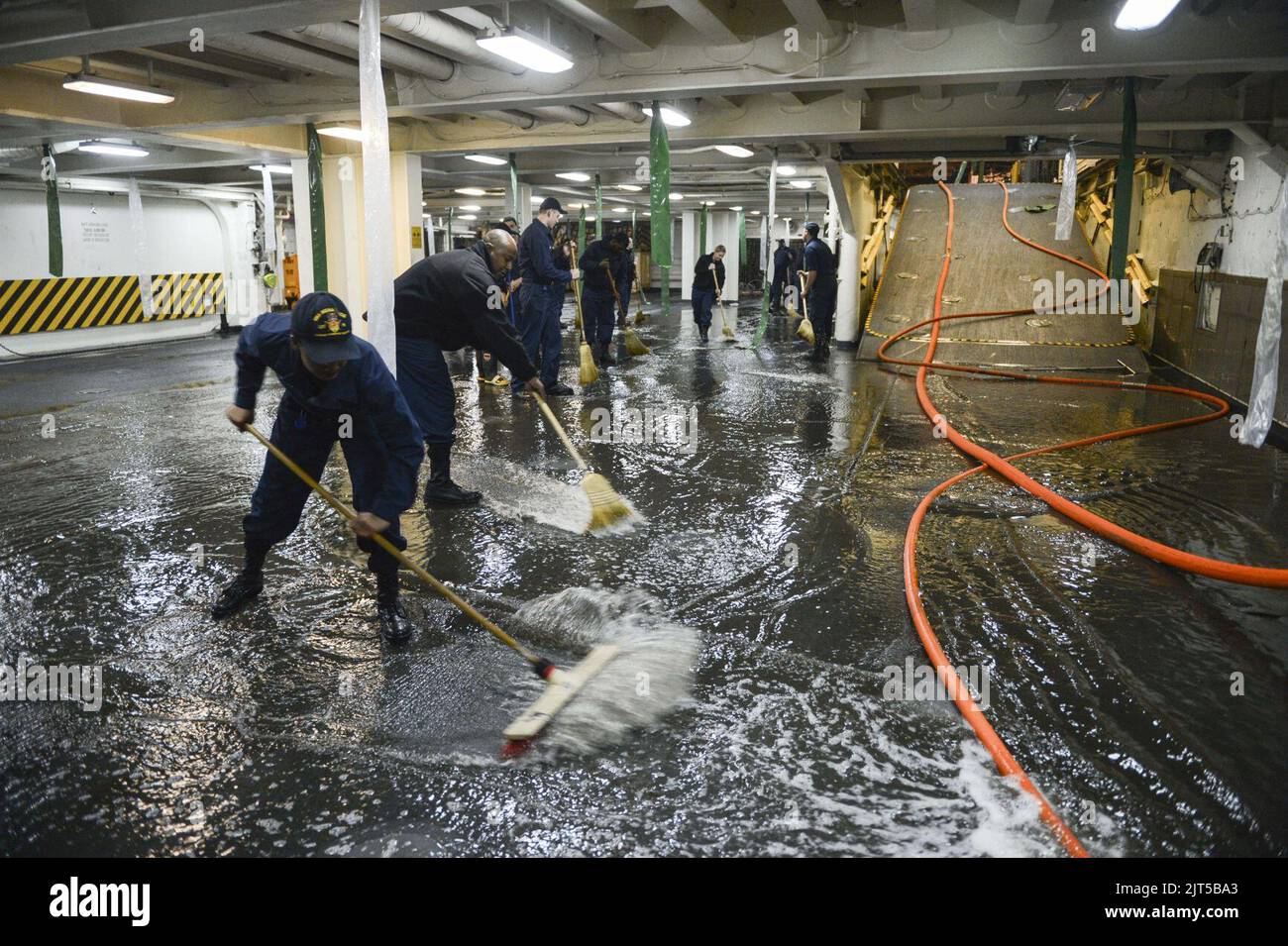 U.S. Sailors aboard the amphibious transport dock ship USS Mesa Verde ...