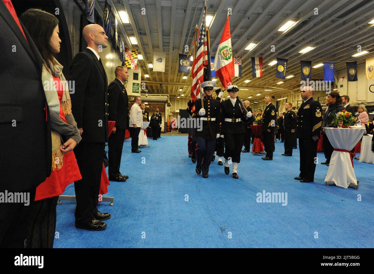 U.S. Sailors and Marines assigned to the amphibious assault ship USS ...