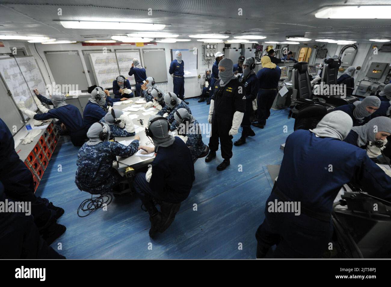 U.S. Sailors assigned to Damage Control Central report and respond to ...