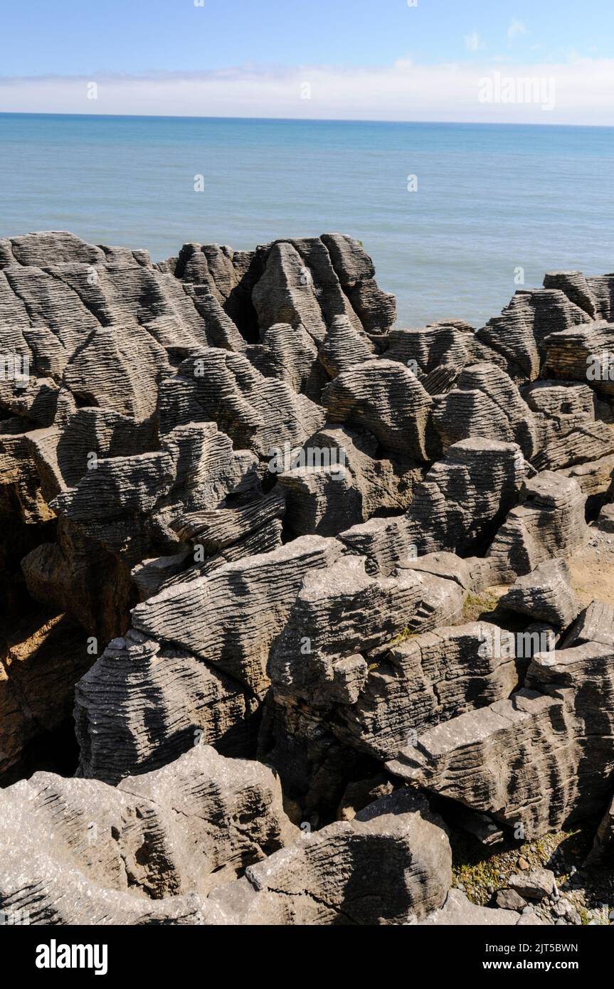 The high lime stoned pancake-shaped rocks blowholes and surge pools at ...