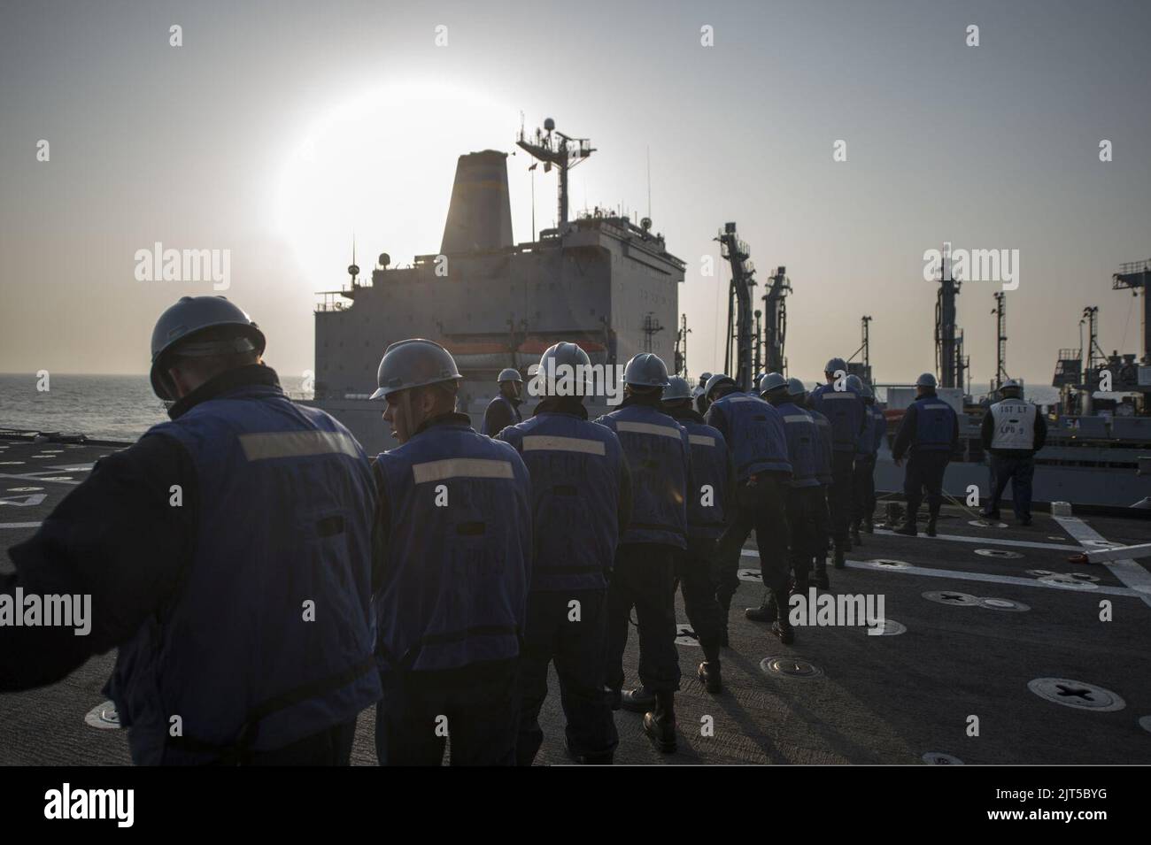 U.S. Sailors assigned to the amphibious transport dock ship USS Denver ...