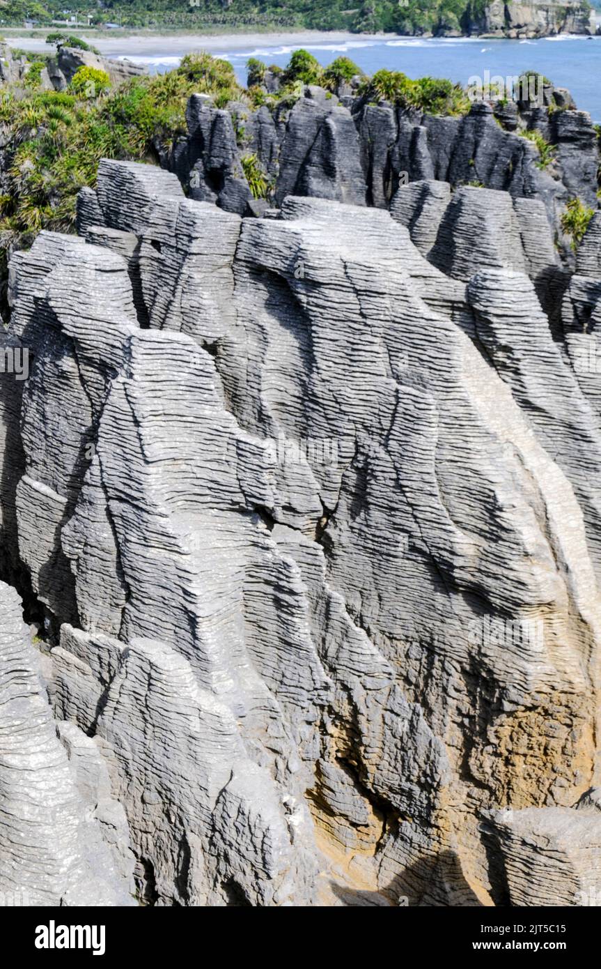 The high lime stoned pancake-shaped rocks blowholes and surge pools at ...