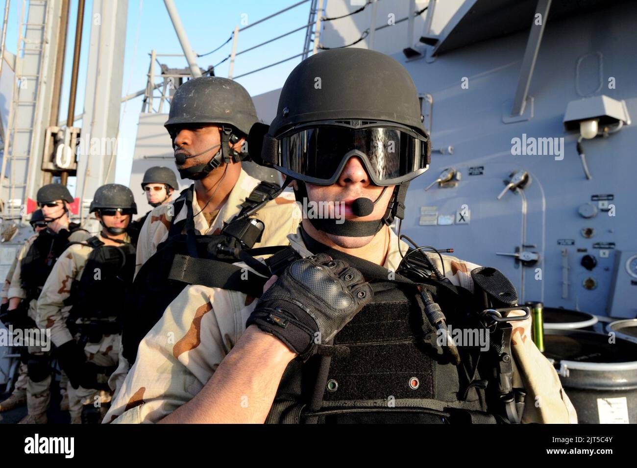 U.S. Sailors assigned to the visit, board, search and seizure team with ...