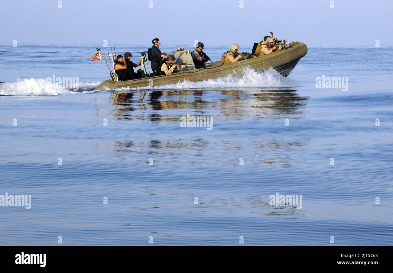 U.S. Sailors from the visit, board, search and seizure team assigned to ...