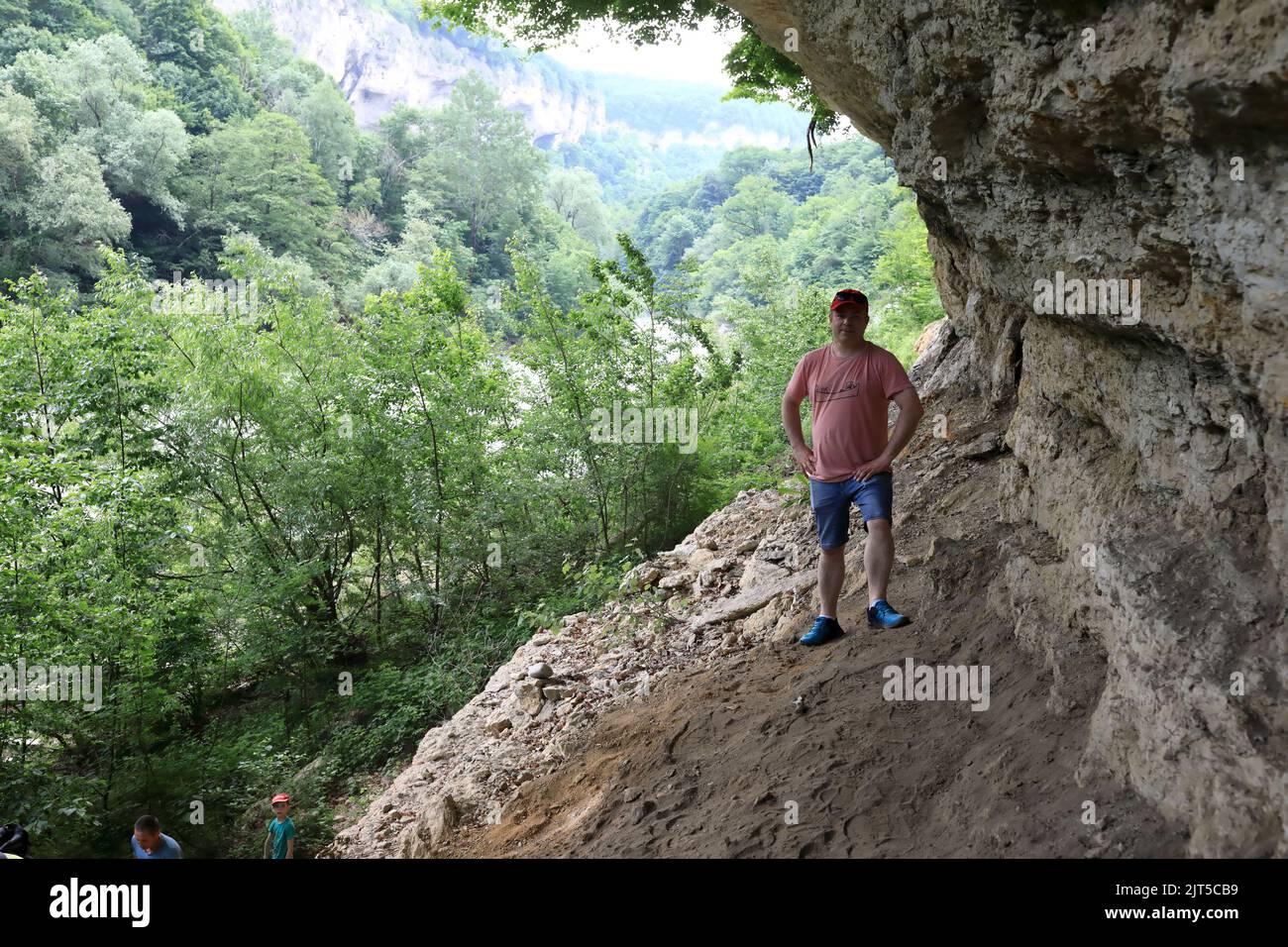 Man posing in grotto of Belaya river valley, Adygea Stock Photo - Alamy