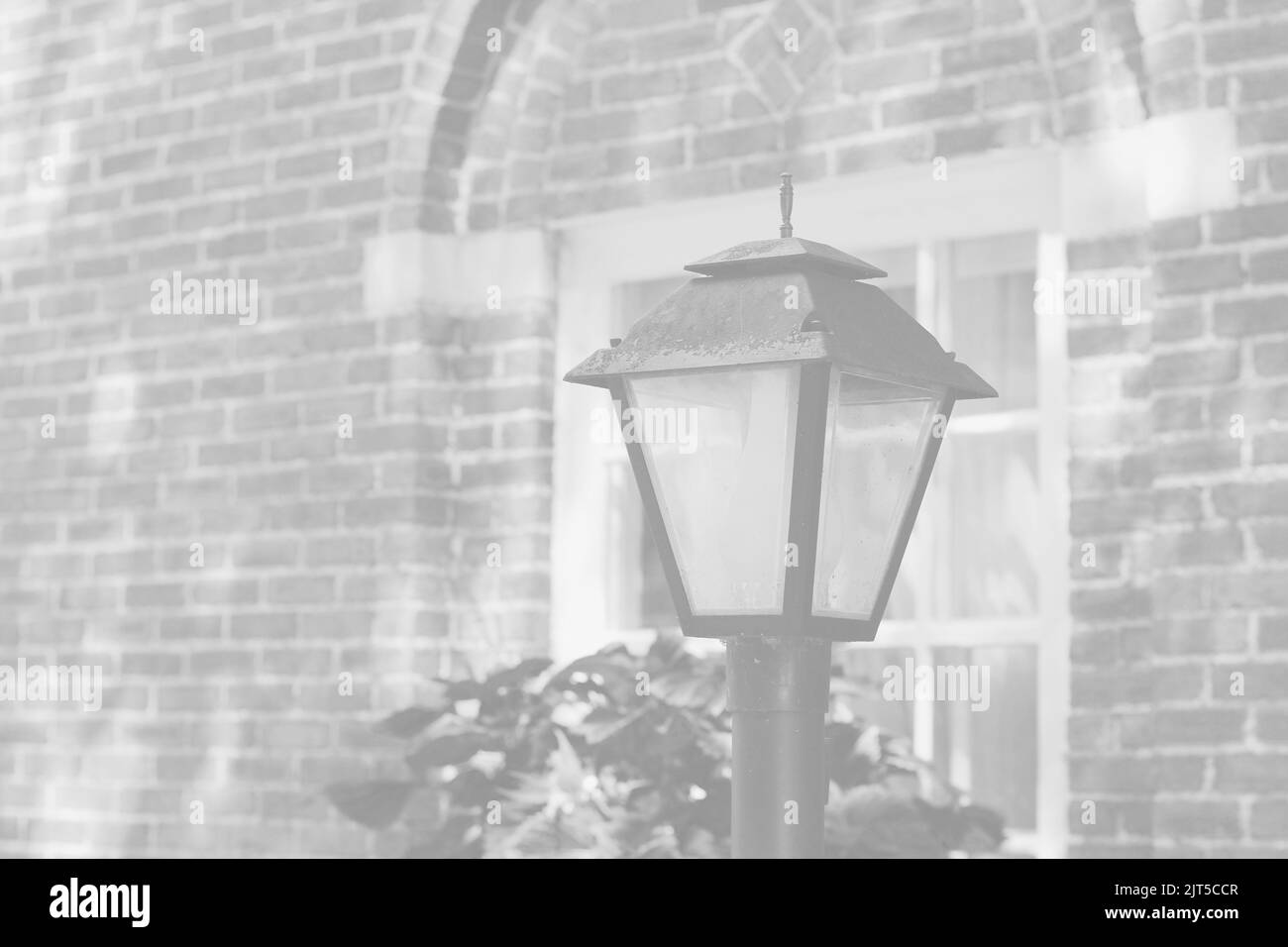Simple typical common cast iron gas light in a faded black and white ...