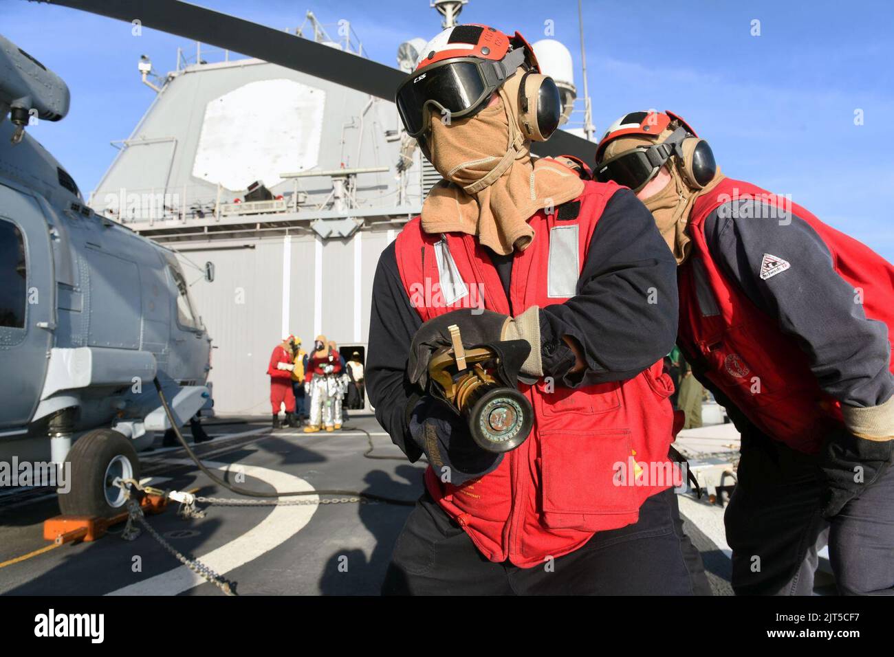 U.S. Sailors prepare to combat a simulated fire during a simulated ...