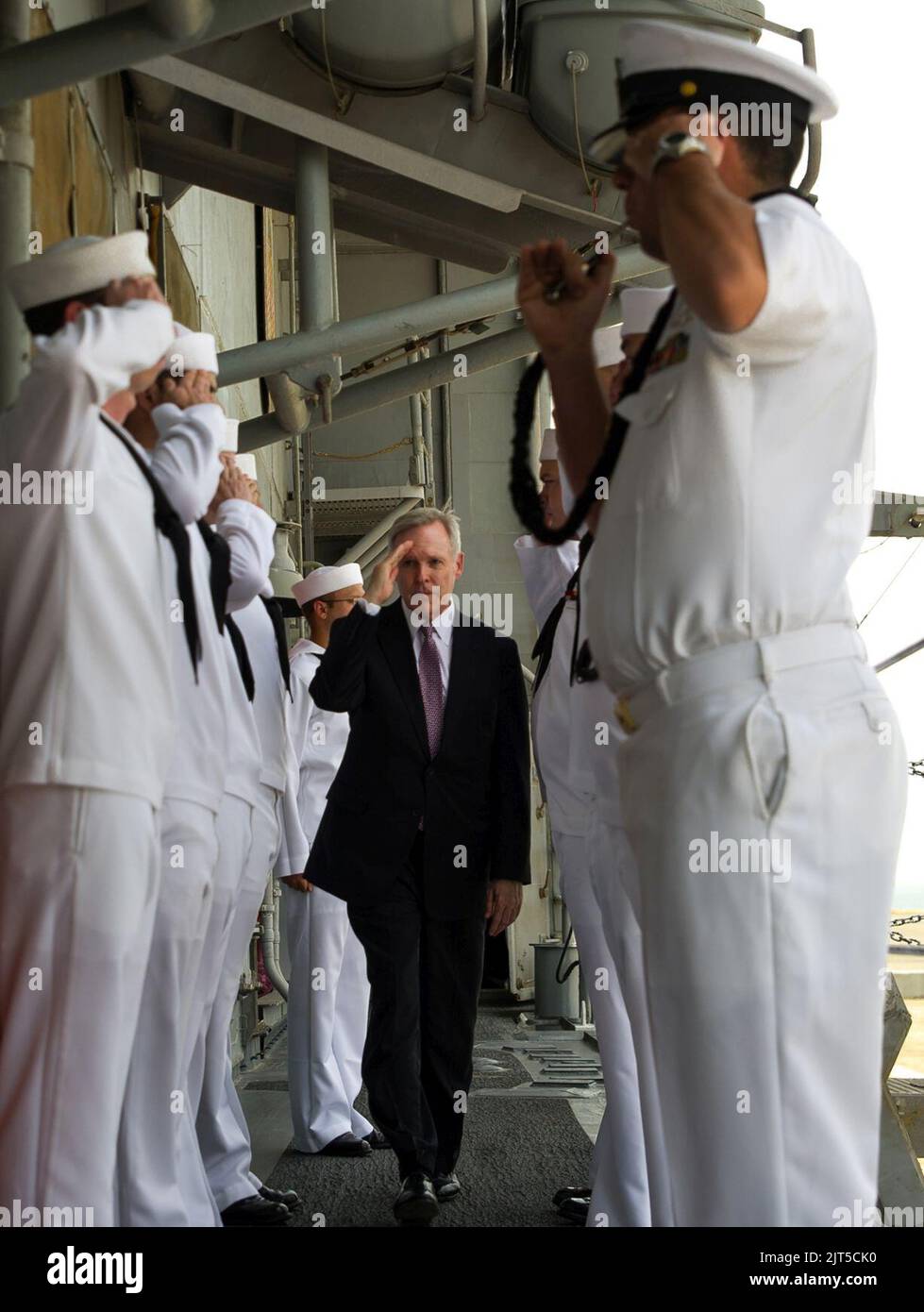 U.S. Sailors salute Secretary of the Navy Ray Mabus as he arrives ...
