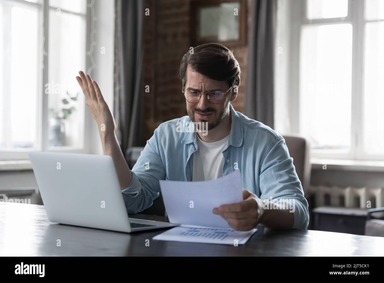 Stressed angry business leader man reading report, getting bad news ...