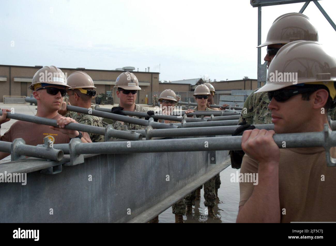 U.S. Sailors with Naval Mobile Construction Battalion (NMCB) 25 and ...