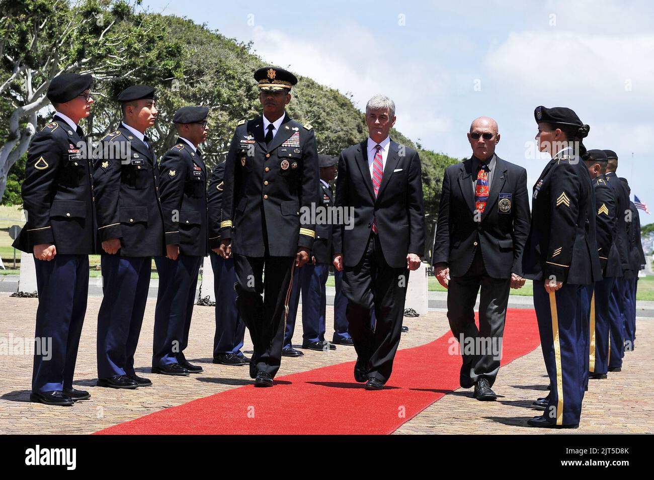 U.S. Secretary of the Army John McHugh, center, along with Army Gen ...