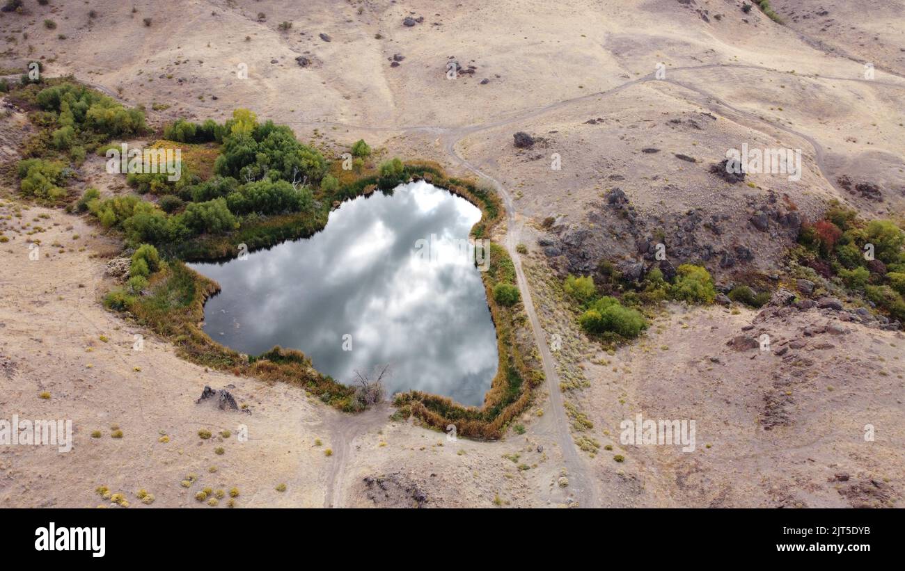A bird's eye view of a small water reservoir in sandy Stock Photo - Alamy
