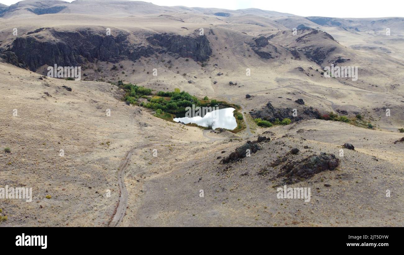 A bird's eye view of a small water reservoir in sandy Stock Photo - Alamy